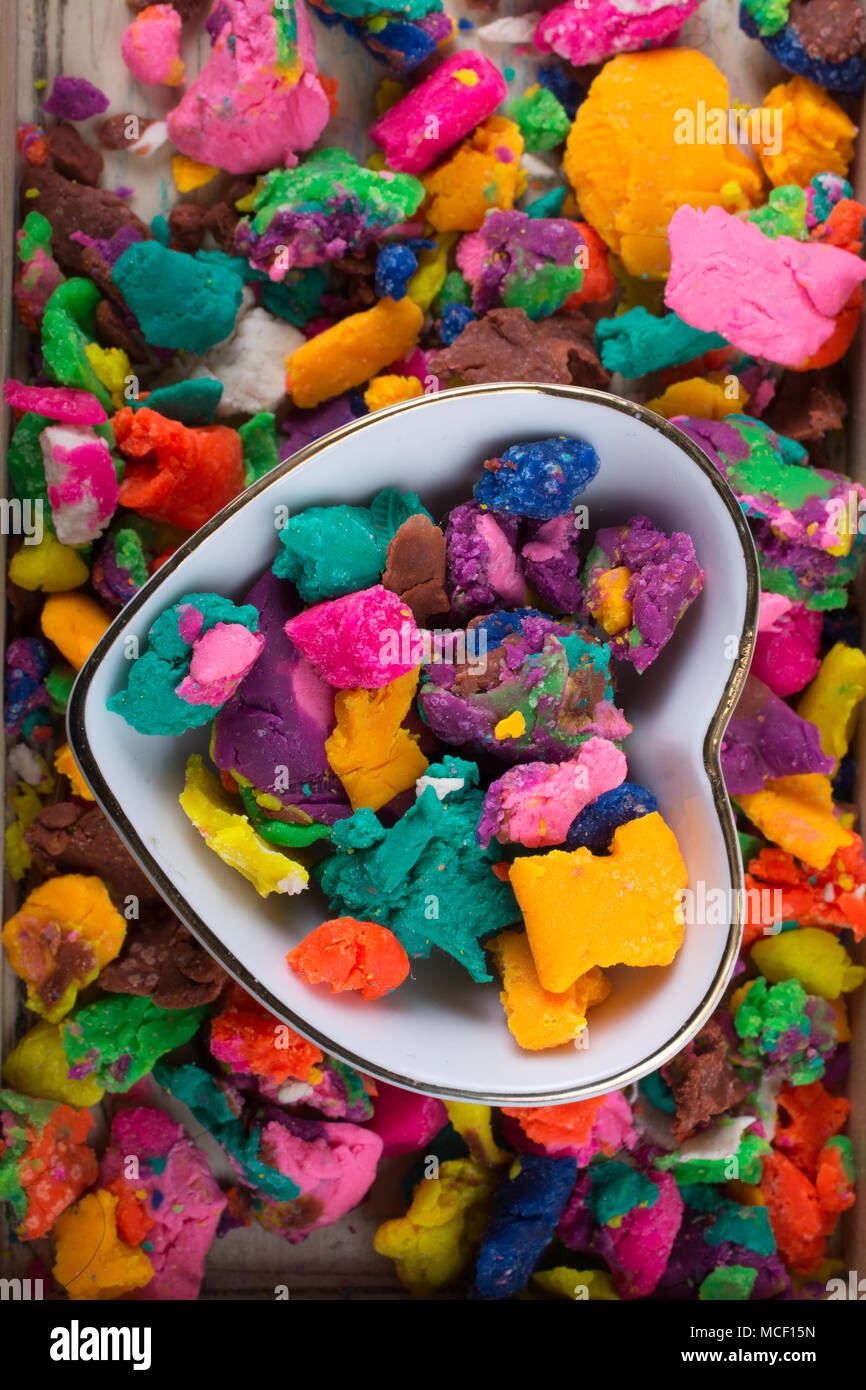 Dry colorful play dough in smal pieces Stock Photo - Alamy