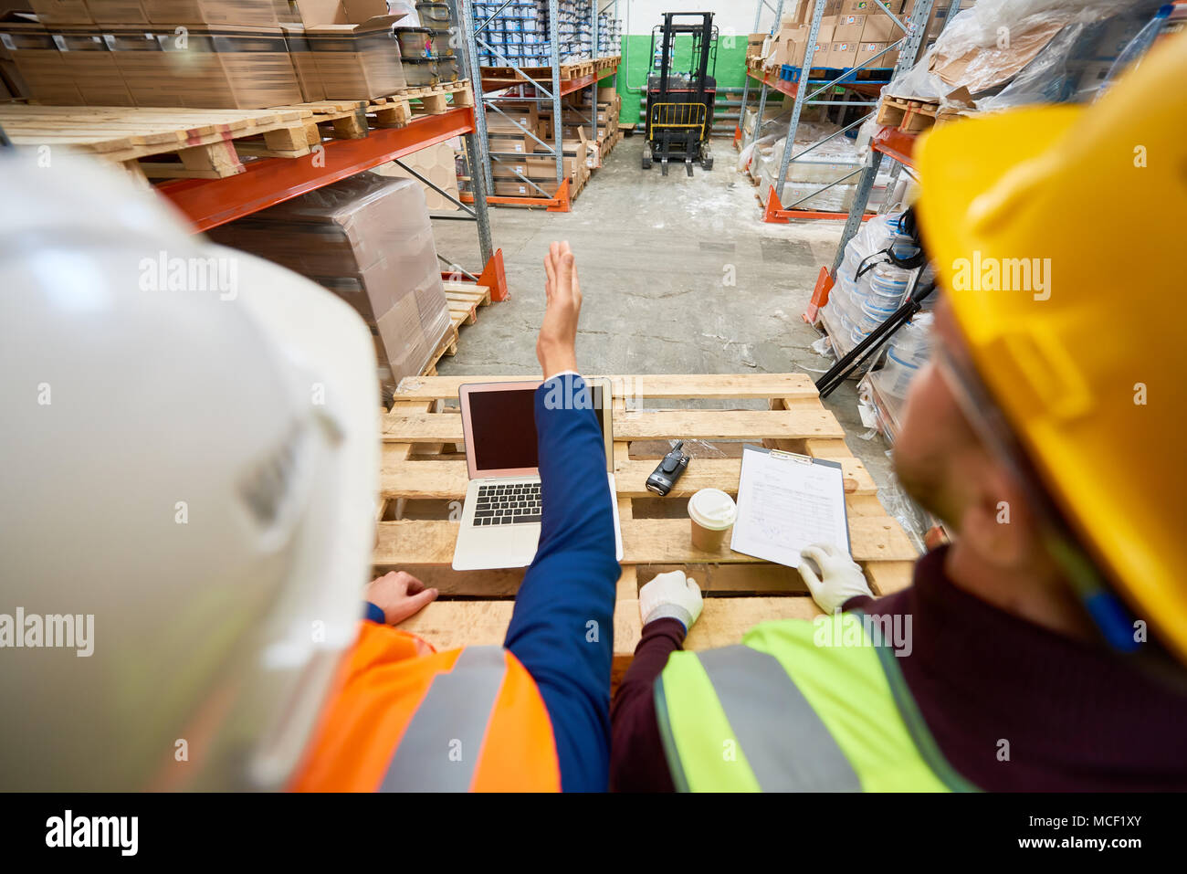 Construction Workers in Warehouse Stock Photo - Alamy