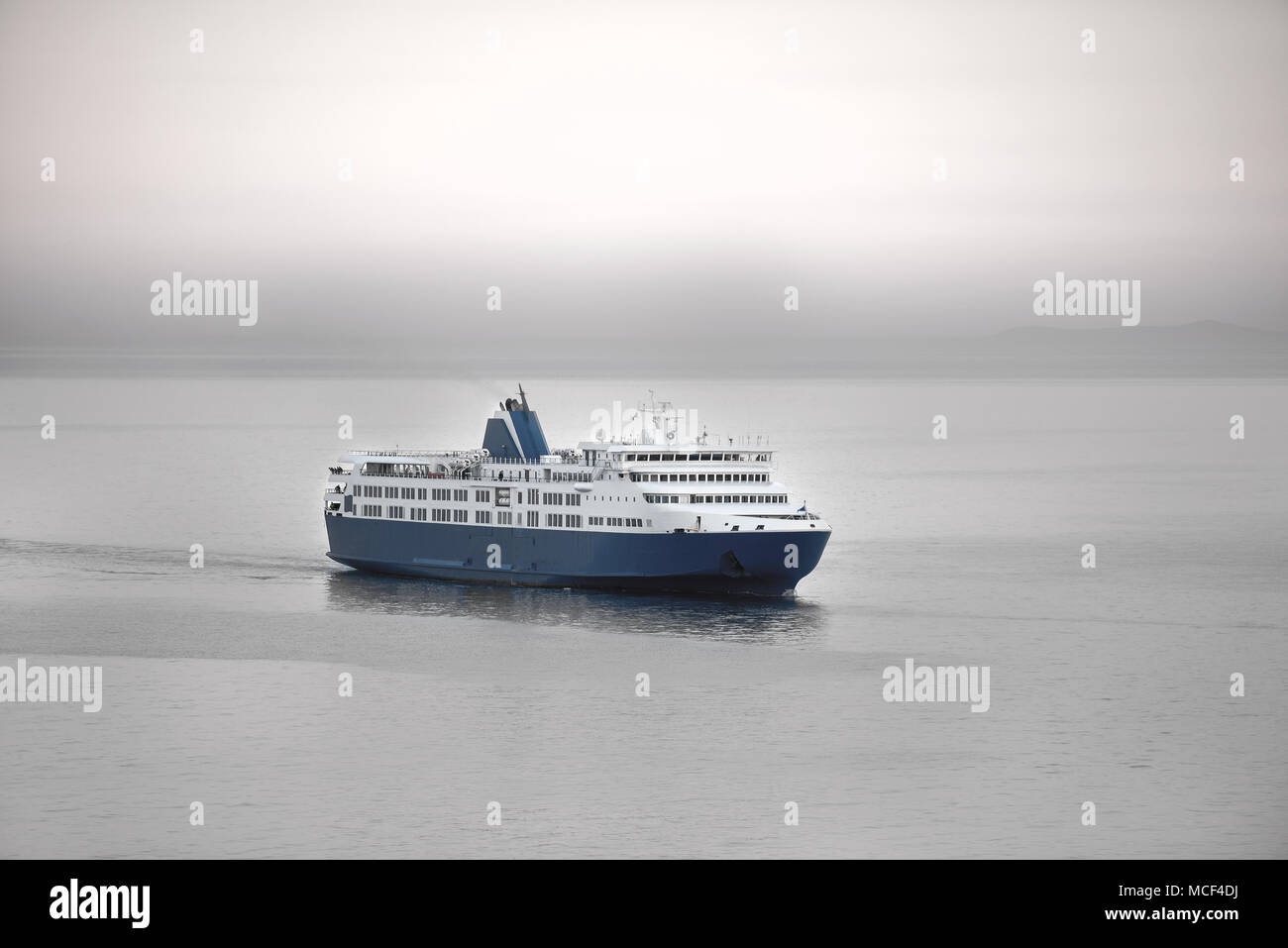 Sunset colors. A blue white ferry boat travel to igreek islands Stock ...