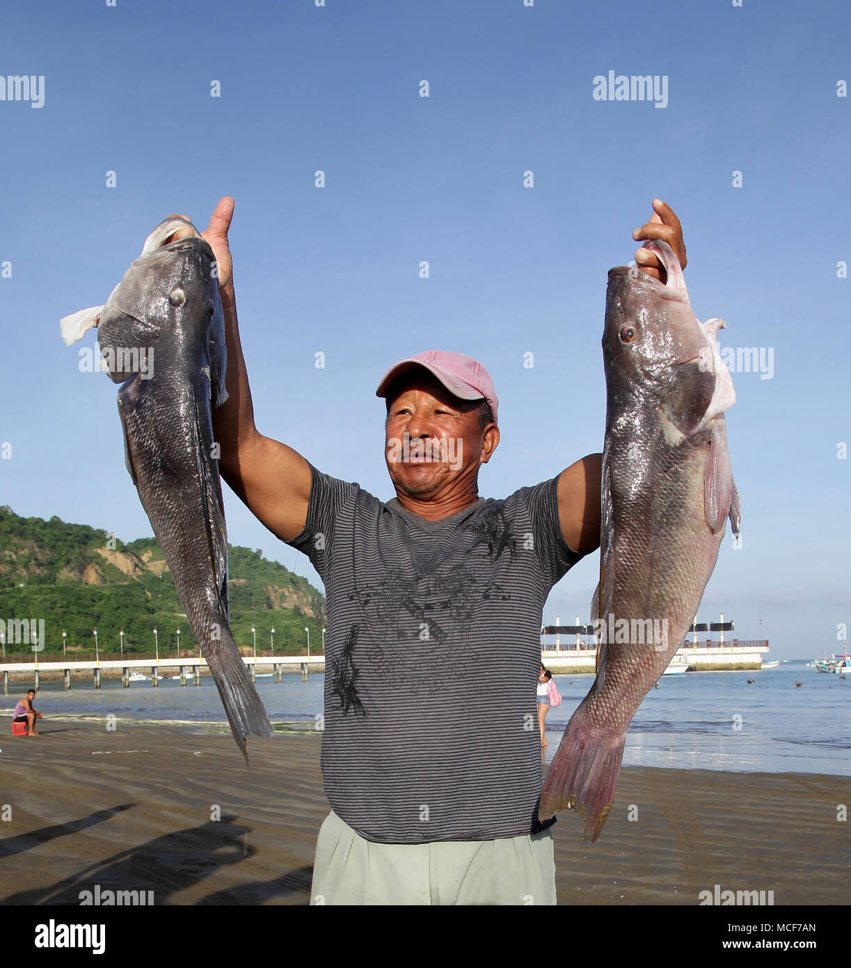 Fisherman at the fishing village Puerto Lopez at the Pacific Coast of ...
