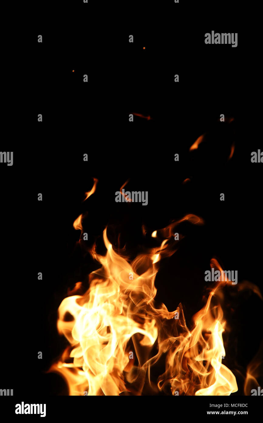 Tongues of flame of fire of orange-yellow color from burning fir Stock ...