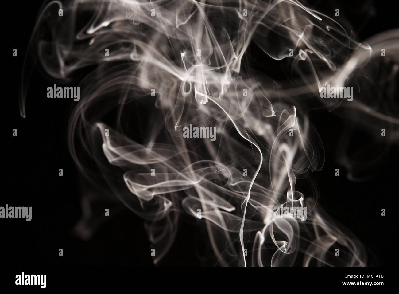 white smoke pattern on black background Stock Photo - Alamy