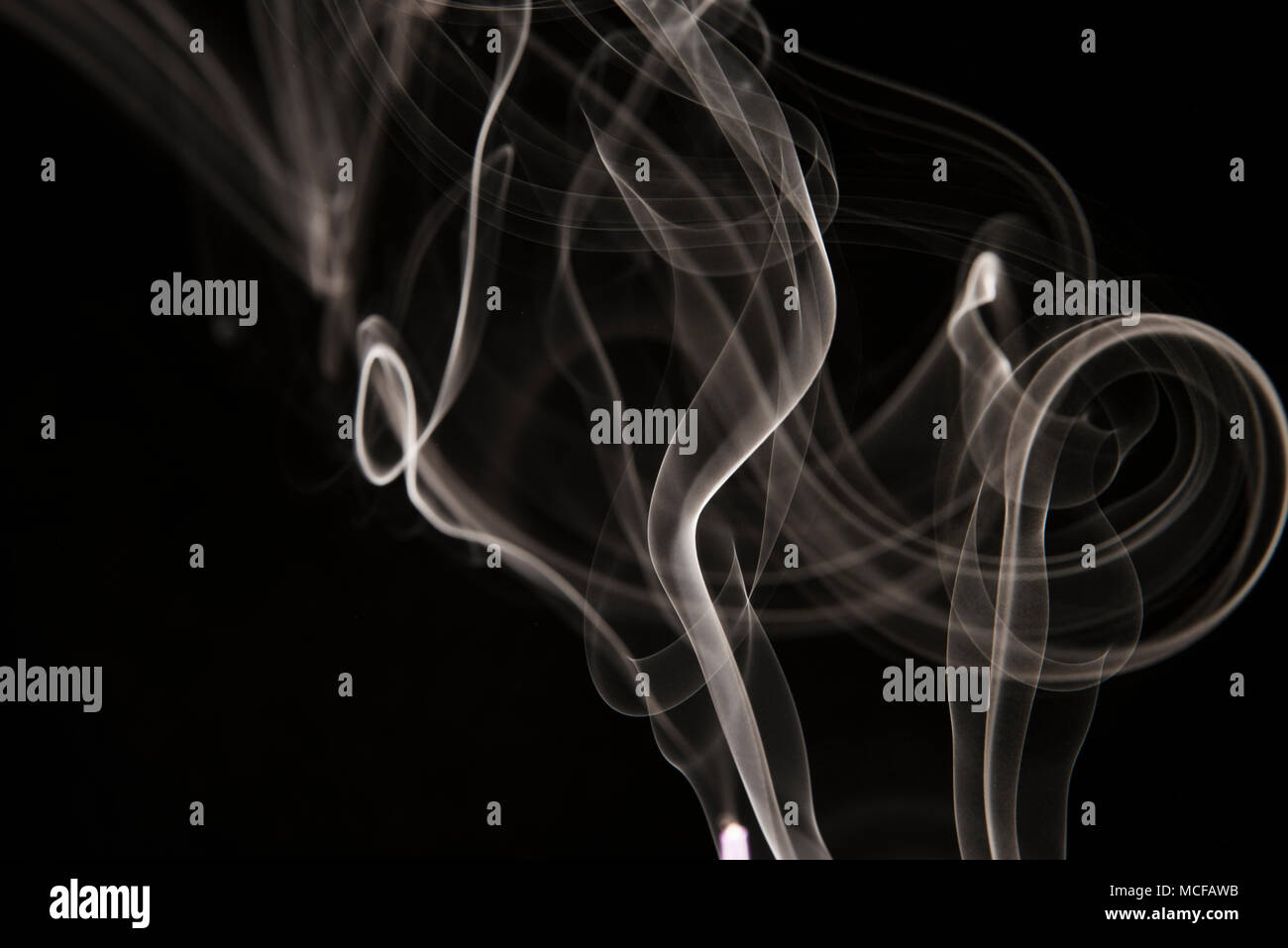 white smoke pattern on black background Stock Photo - Alamy