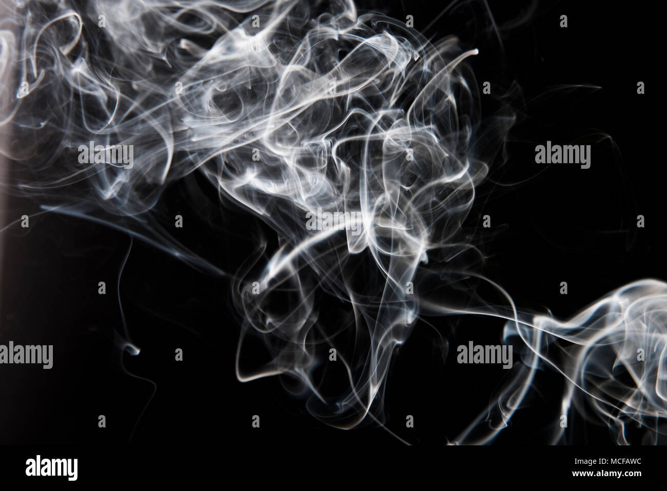 white smoke pattern on black background Stock Photo - Alamy