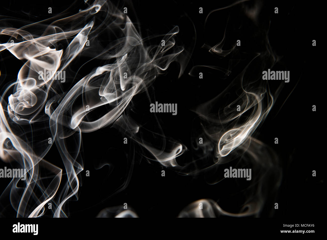 white smoke pattern on black background Stock Photo - Alamy