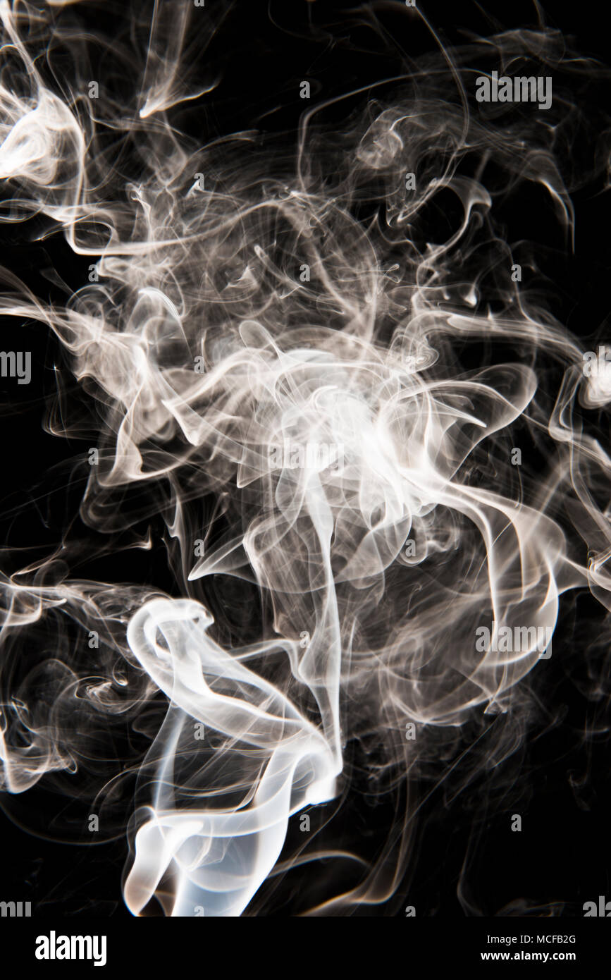 white smoke pattern on black background Stock Photo - Alamy
