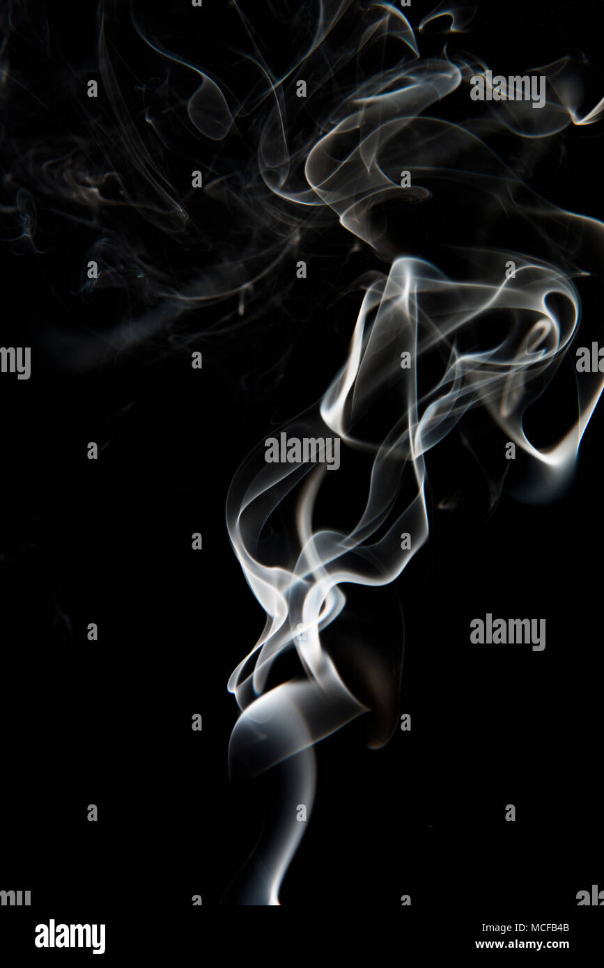 white smoke pattern on black background Stock Photo - Alamy