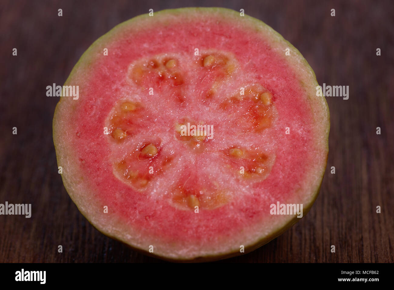 half of ripe , pink guava close up Stock Photo - Alamy