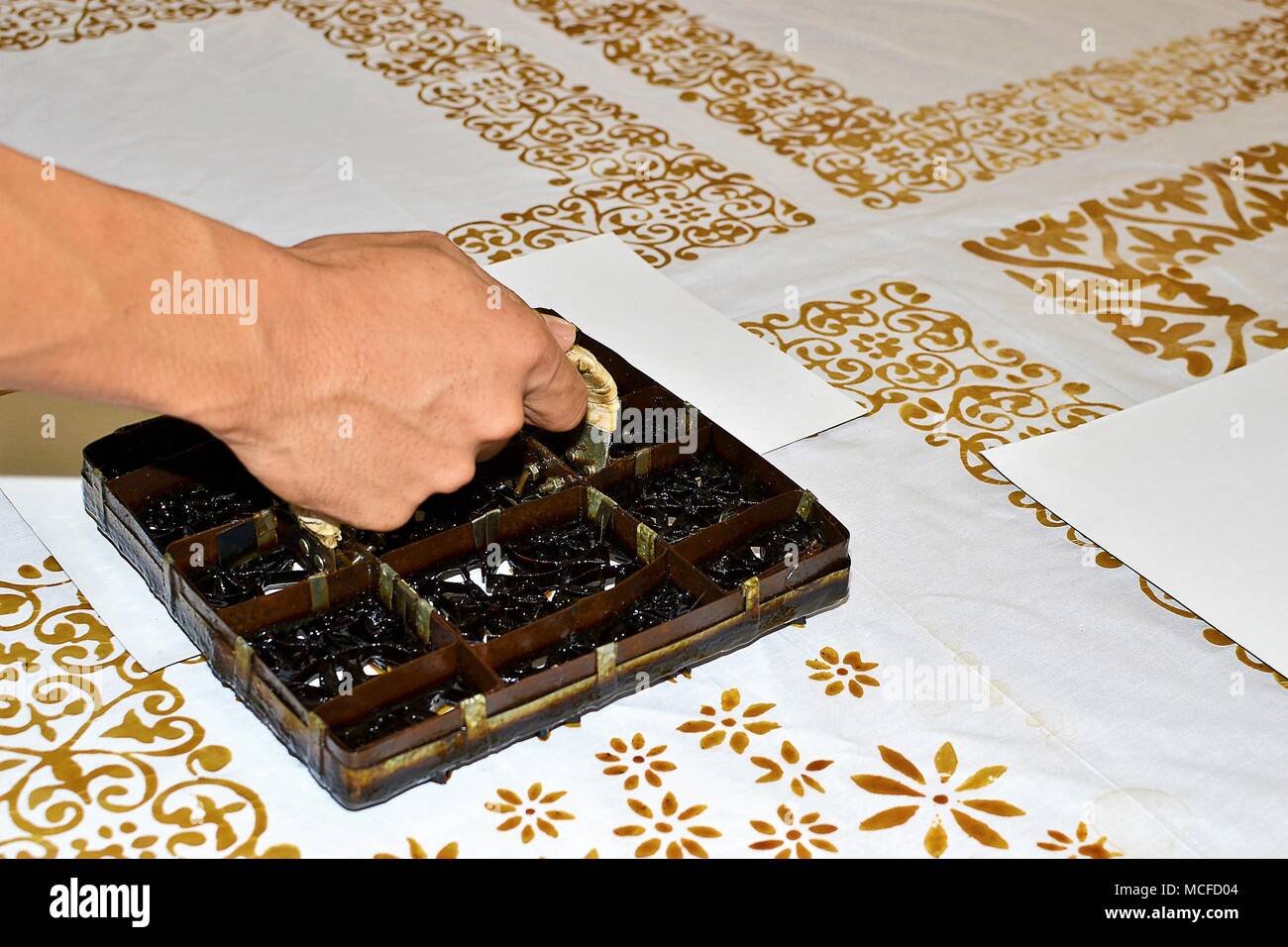 Close Up Hand Painting Batik With Stamp on the Fabric Stock Photo - Alamy