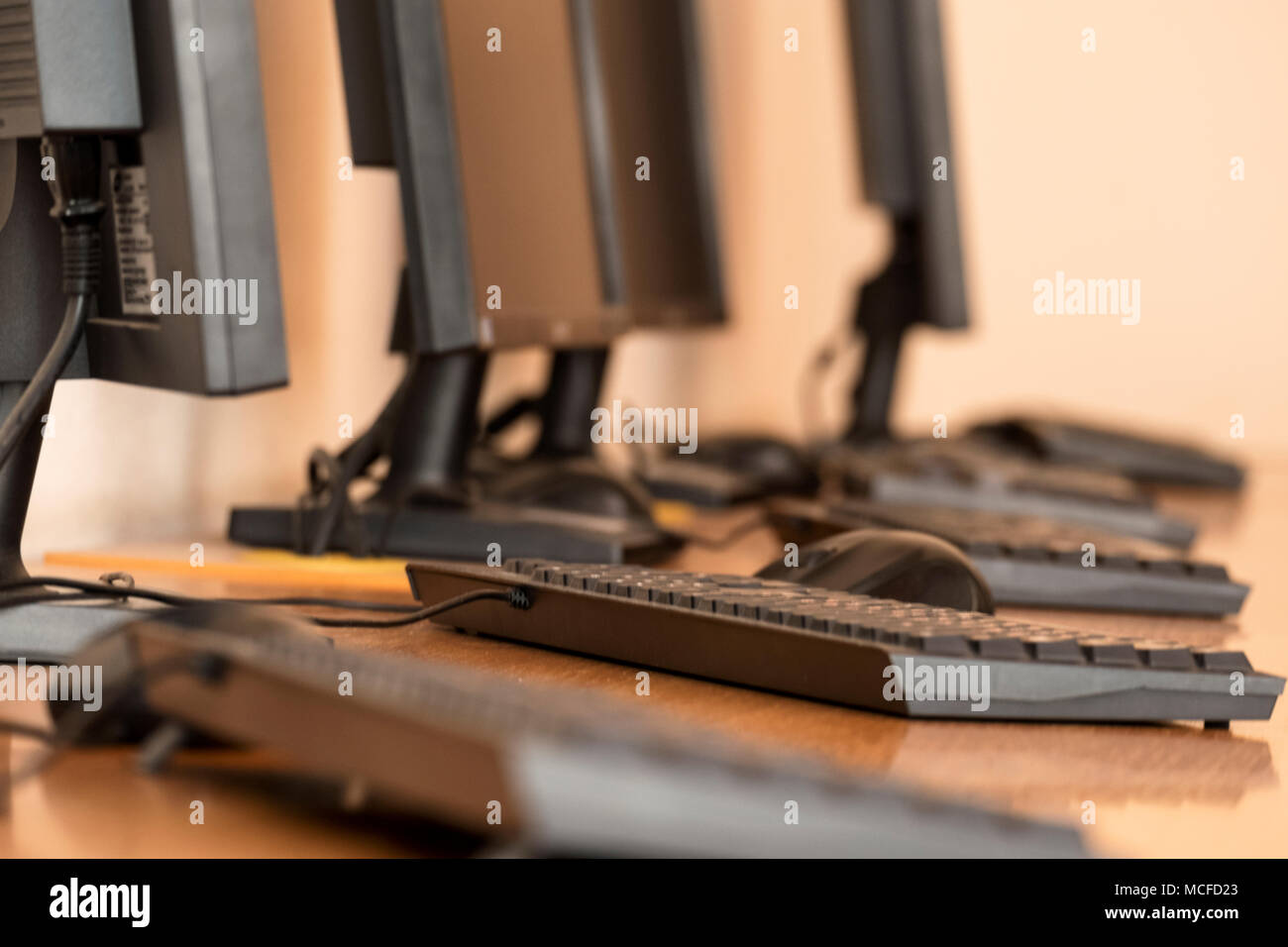 Workstations. Workplace room with computers from low angle Stock Photo ...