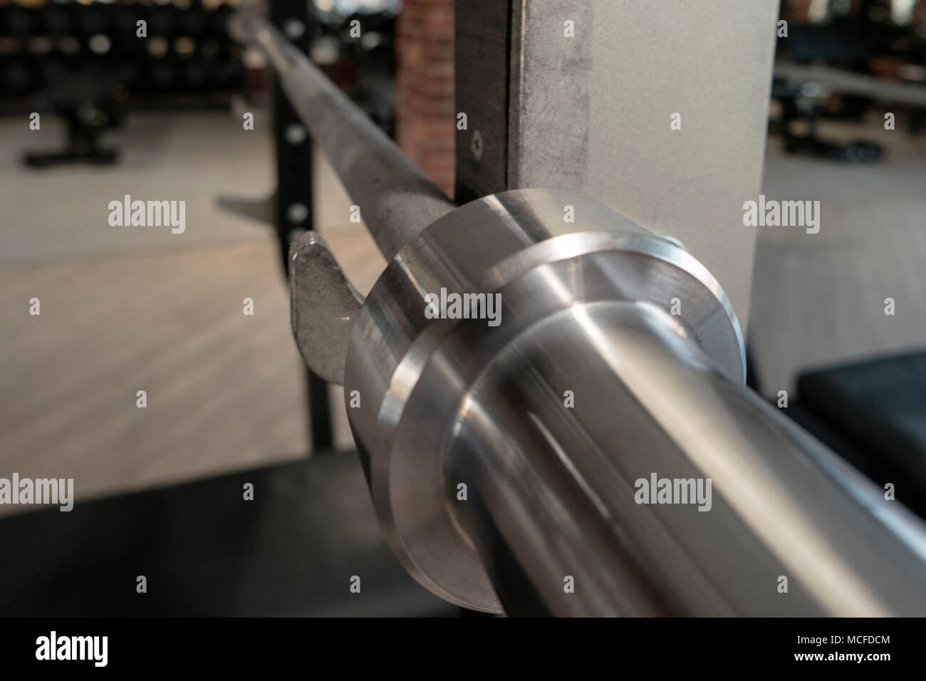 Barbell bar without weights in gym Stock Photo - Alamy