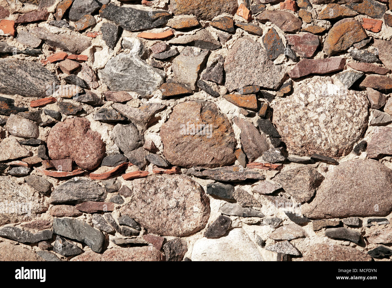 Wall of big stones and broken bricks Stock Photo - Alamy