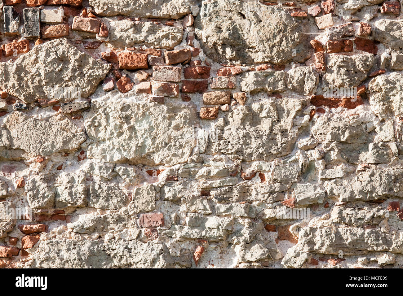 Wall of big stones and broken bricks Stock Photo - Alamy