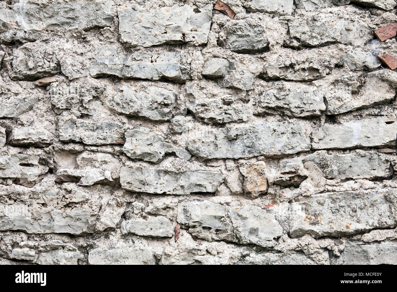 Wall of big stones and broken bricks Stock Photo - Alamy