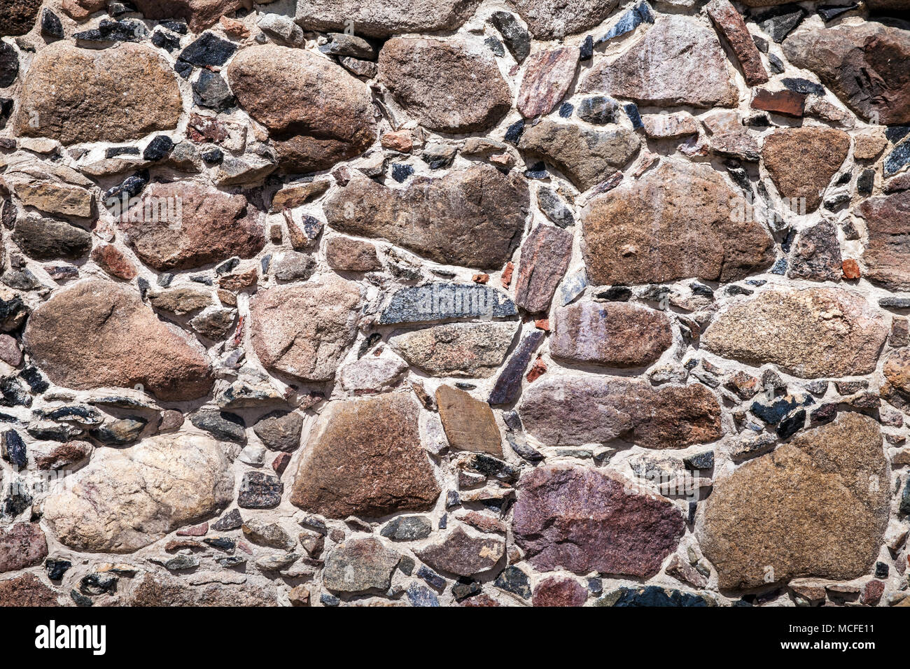 Wall of big stones and broken bricks Stock Photo - Alamy