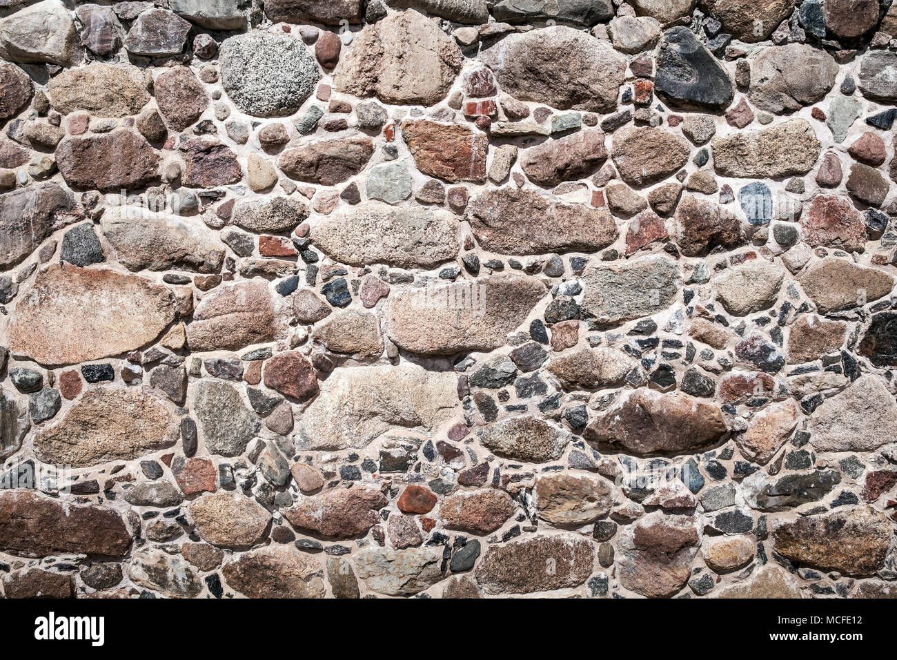 Wall of big stones and broken bricks Stock Photo - Alamy