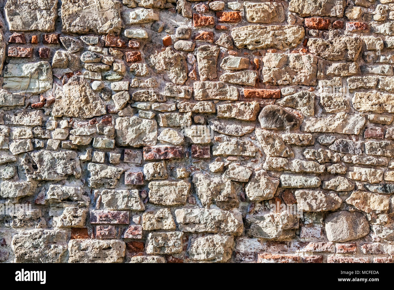 Wall of big stones and broken bricks Stock Photo - Alamy
