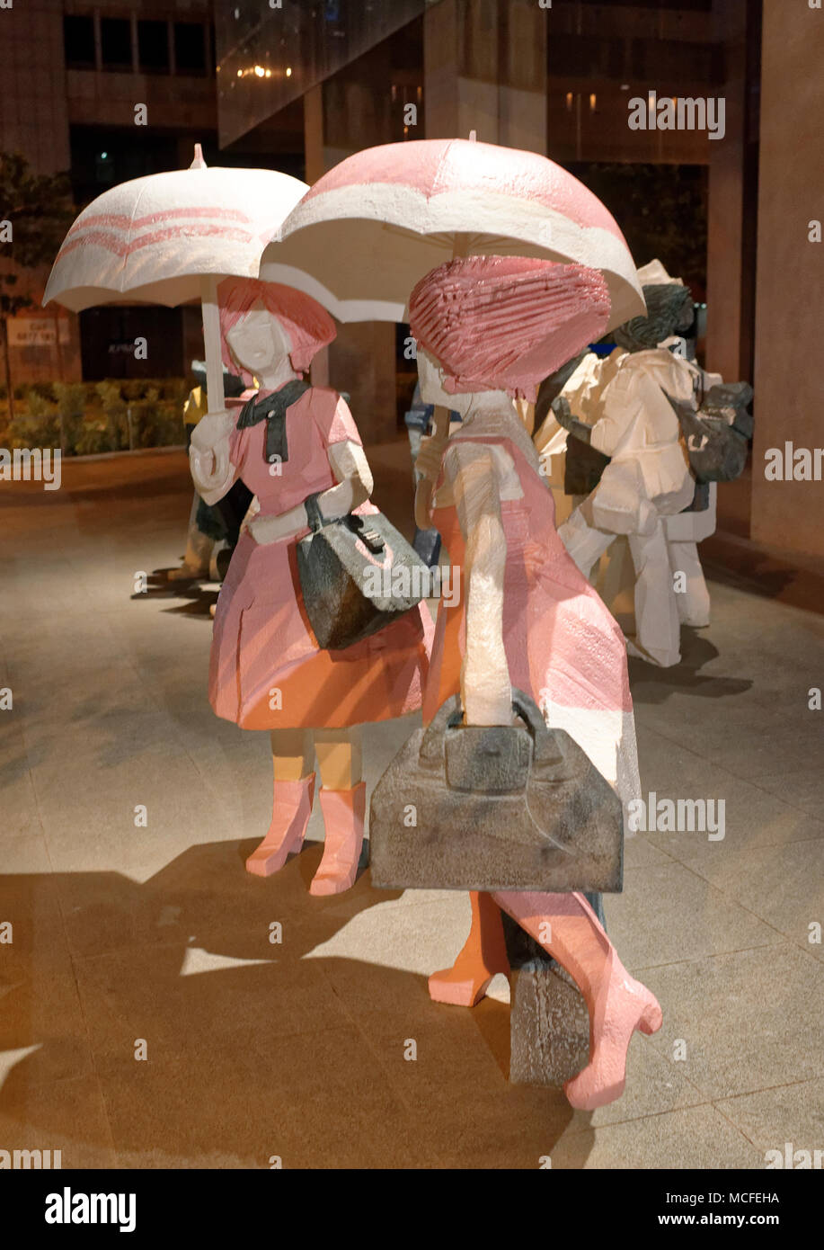 Statues on the street, blocky and surreal, Singapore business district ...