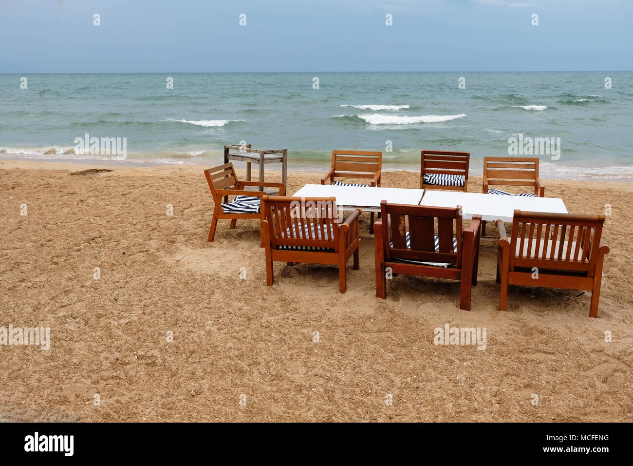 Dinner table set on the beach Stock Photo - Alamy