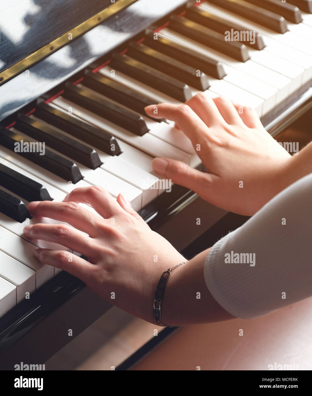 lady hand is playing piano for music Stock Photo - Alamy