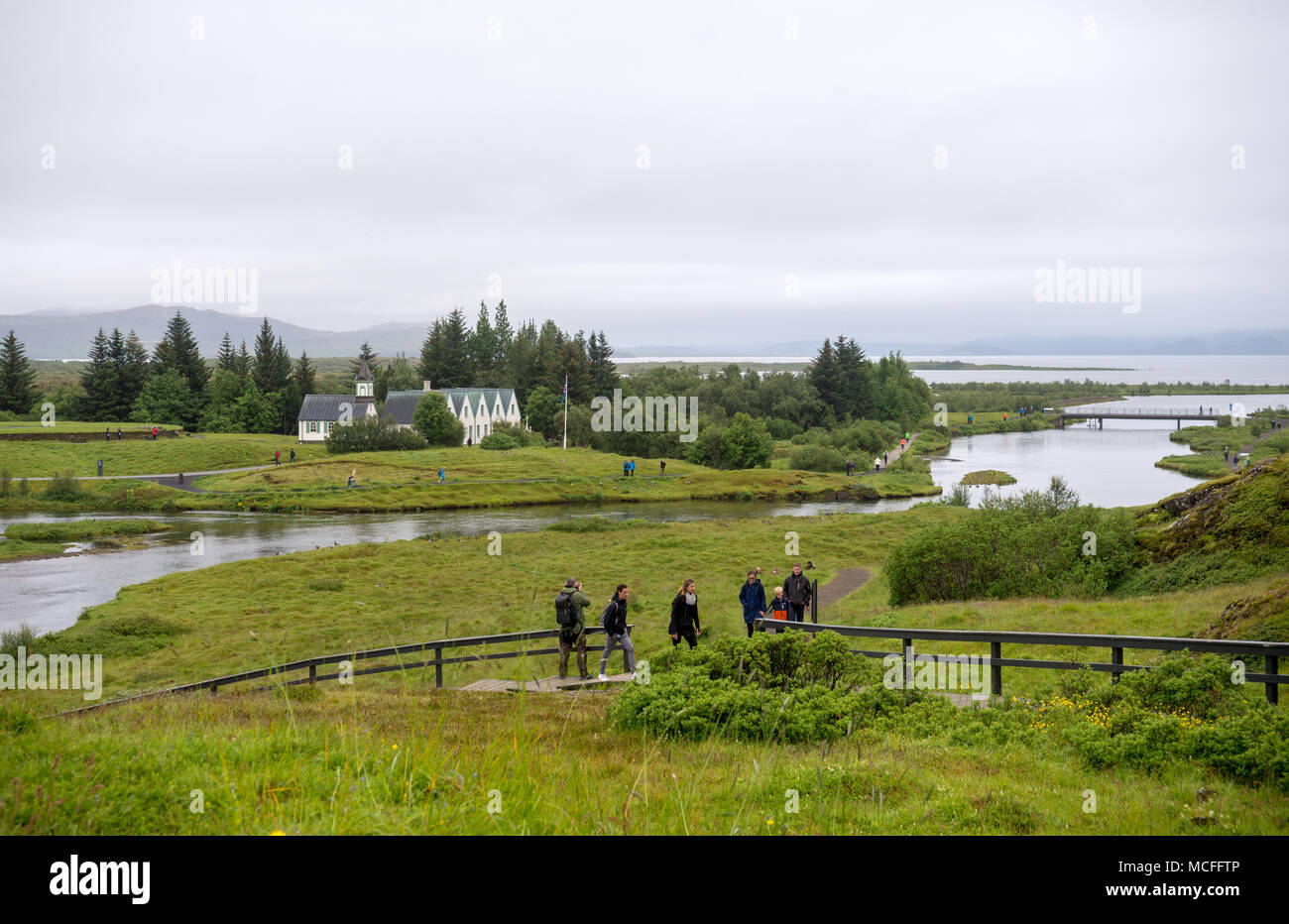 Thingvellir, Iceland - July 19, 2017: Tourists walk through the ...