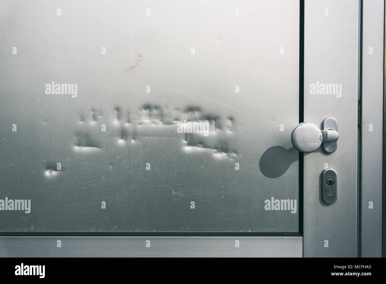 Close-up of metal heavy duty door with dents Stock Photo - Alamy