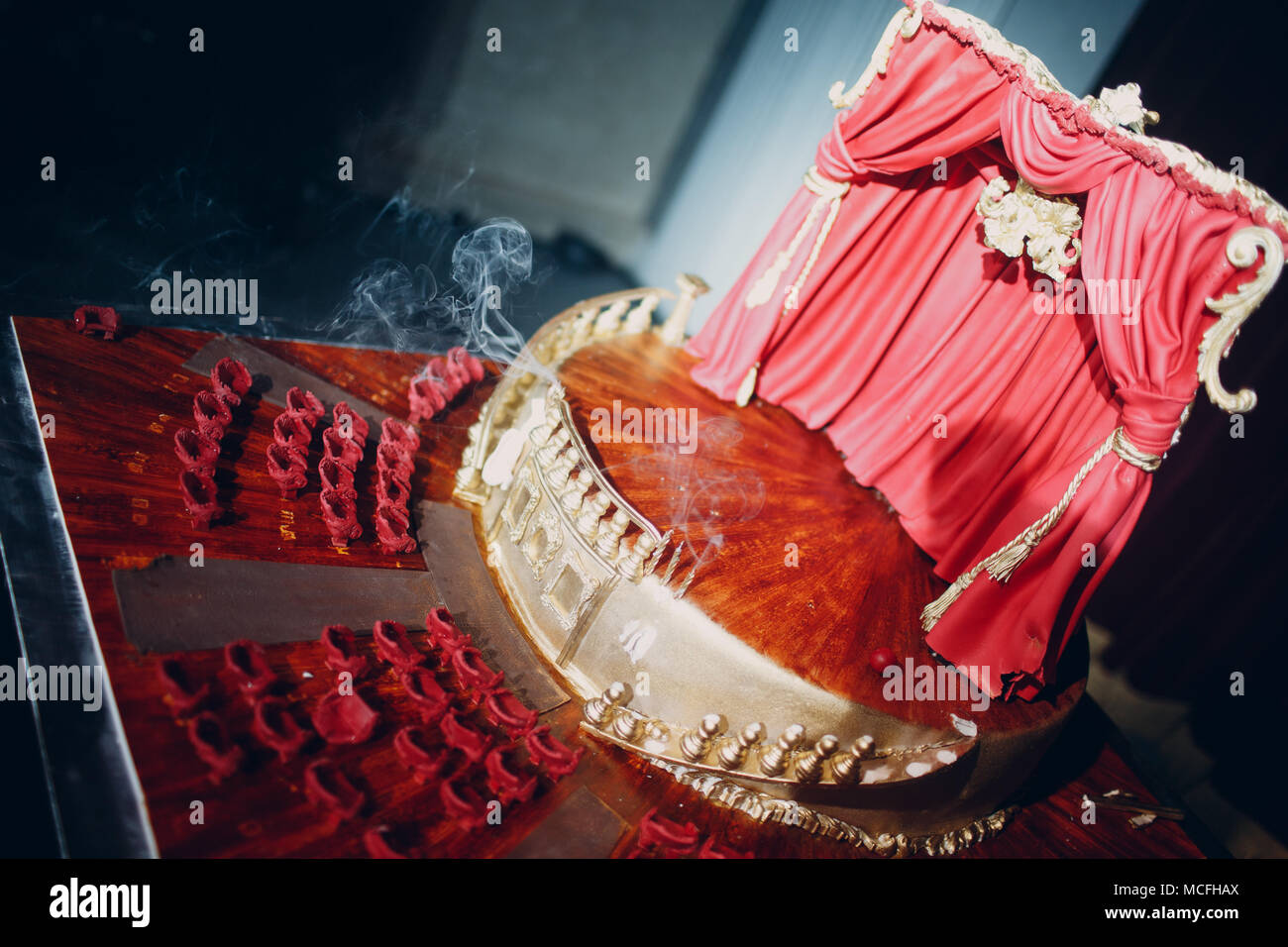 Cake in the form of a theatrical scene Stock Photo - Alamy