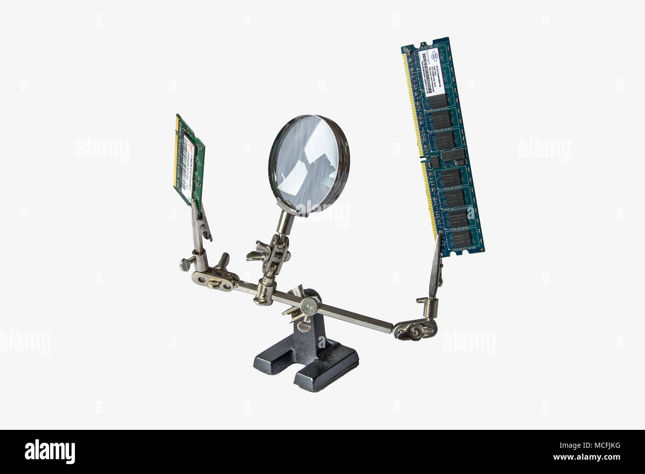 solder helping hands holding DDR memory. looks like a robot or as if it ...