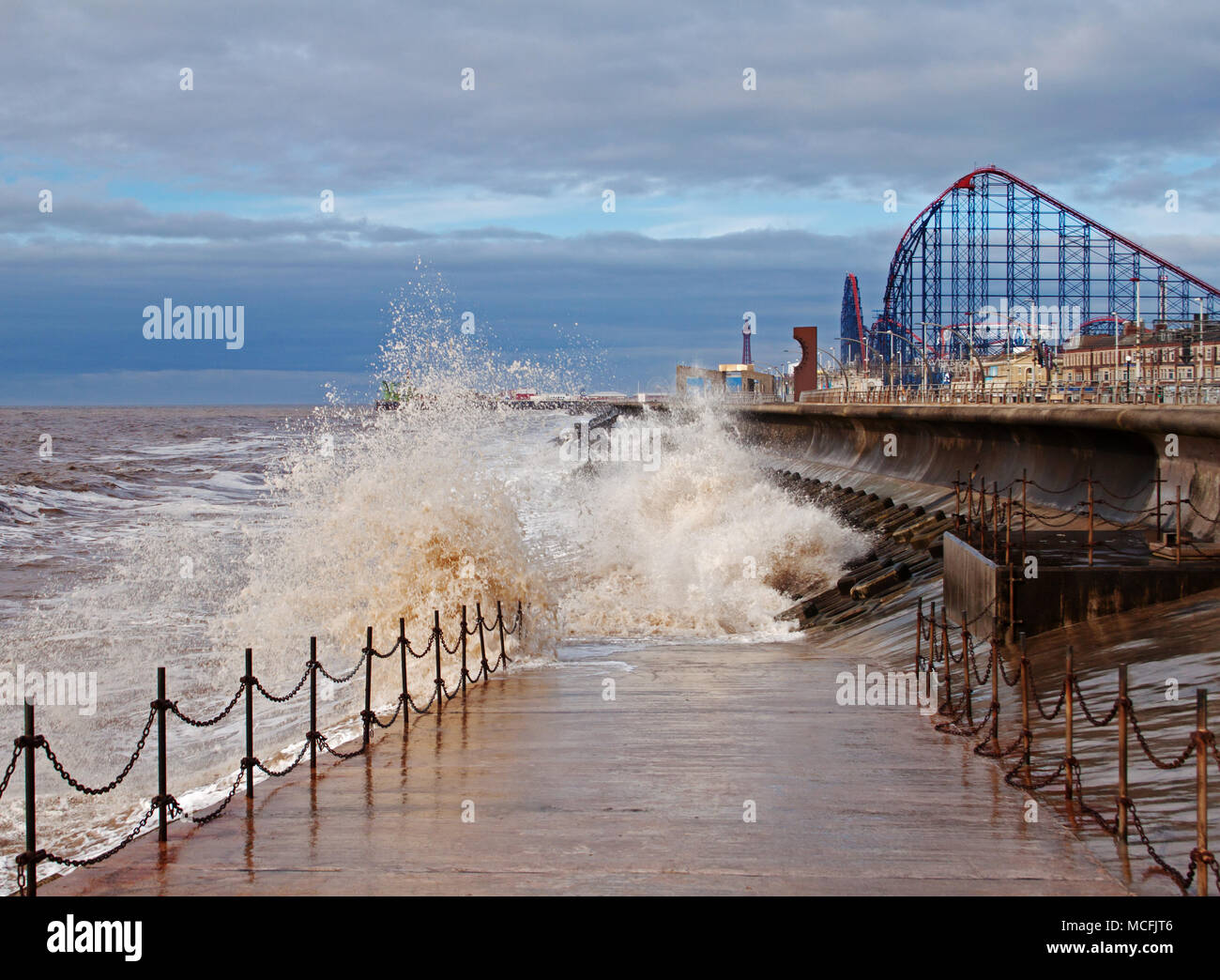 Waves splashing against Blackpool's sea defence, making a picturesque ...