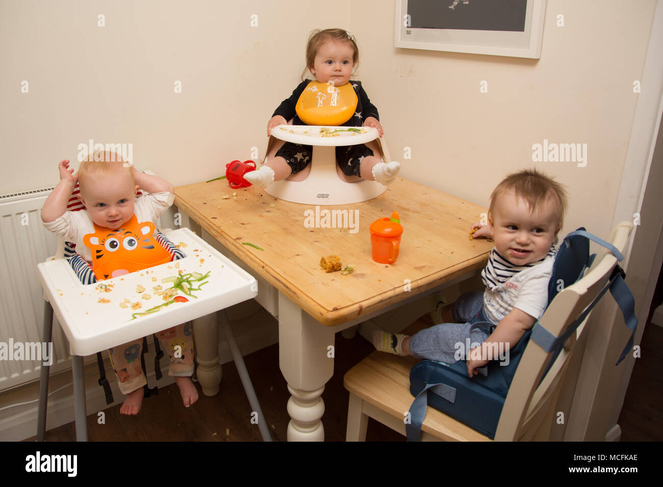 Babies and toddlers having a snack at nursery, UK Stock Photo - Alamy