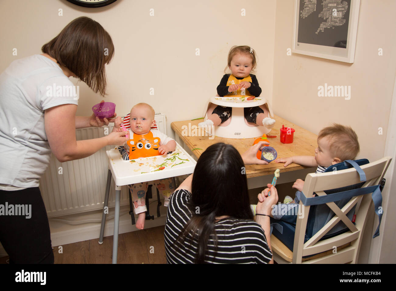 Babies and toddlers having a snack at nursery, UK Stock Photo - Alamy