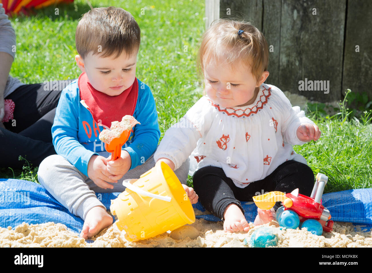 Happy kids playing puzzles hi-res stock photography and images - Alamy