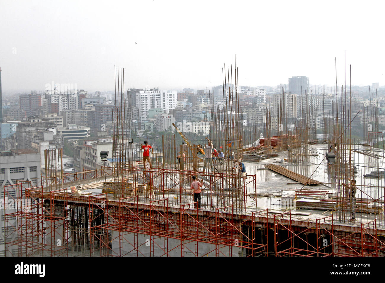 Dhaka, Bangladesh. Bangladeshi construction labors work on a new high ...