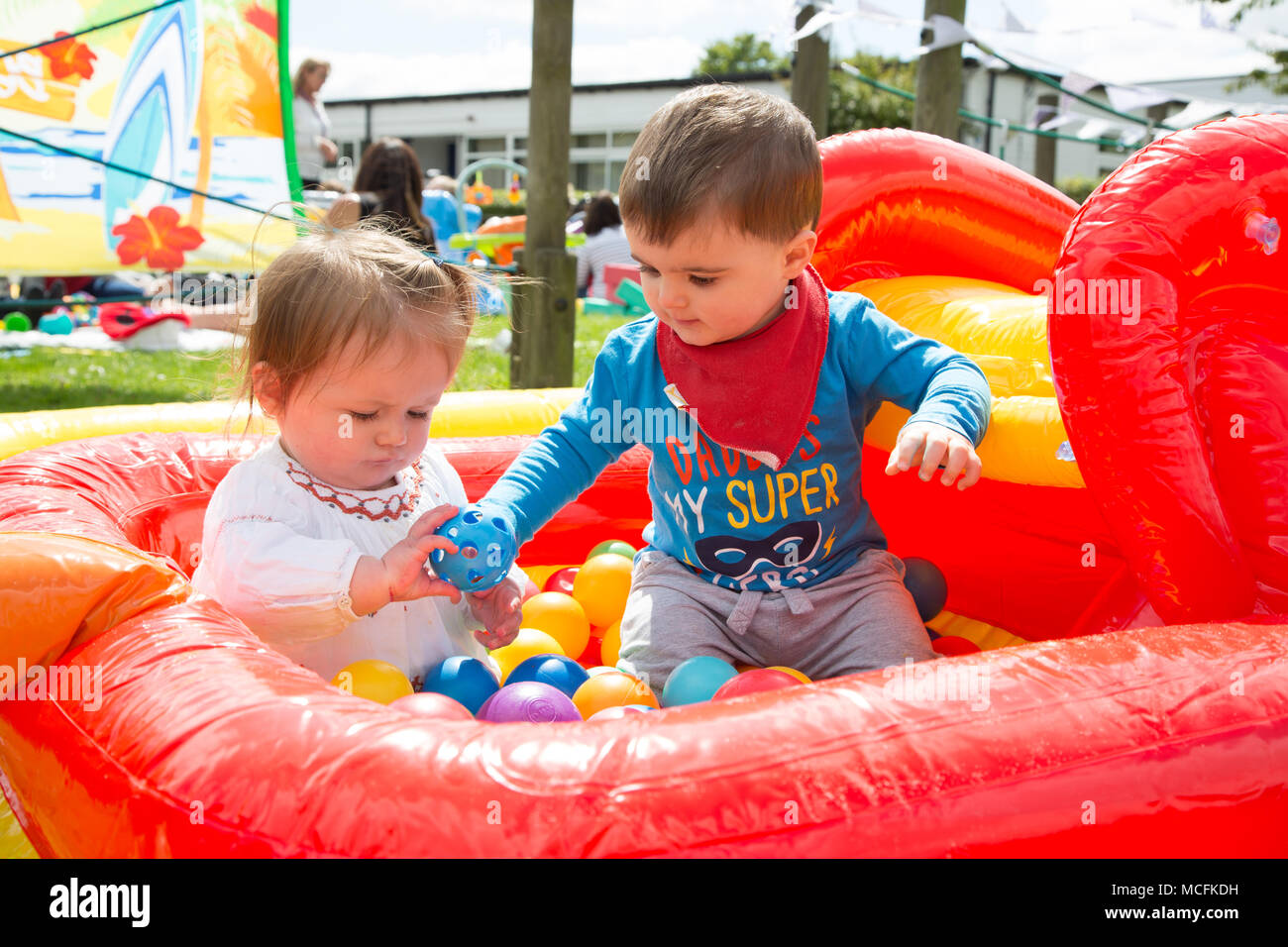 Children sharing toys hi-res stock photography and images - Alamy