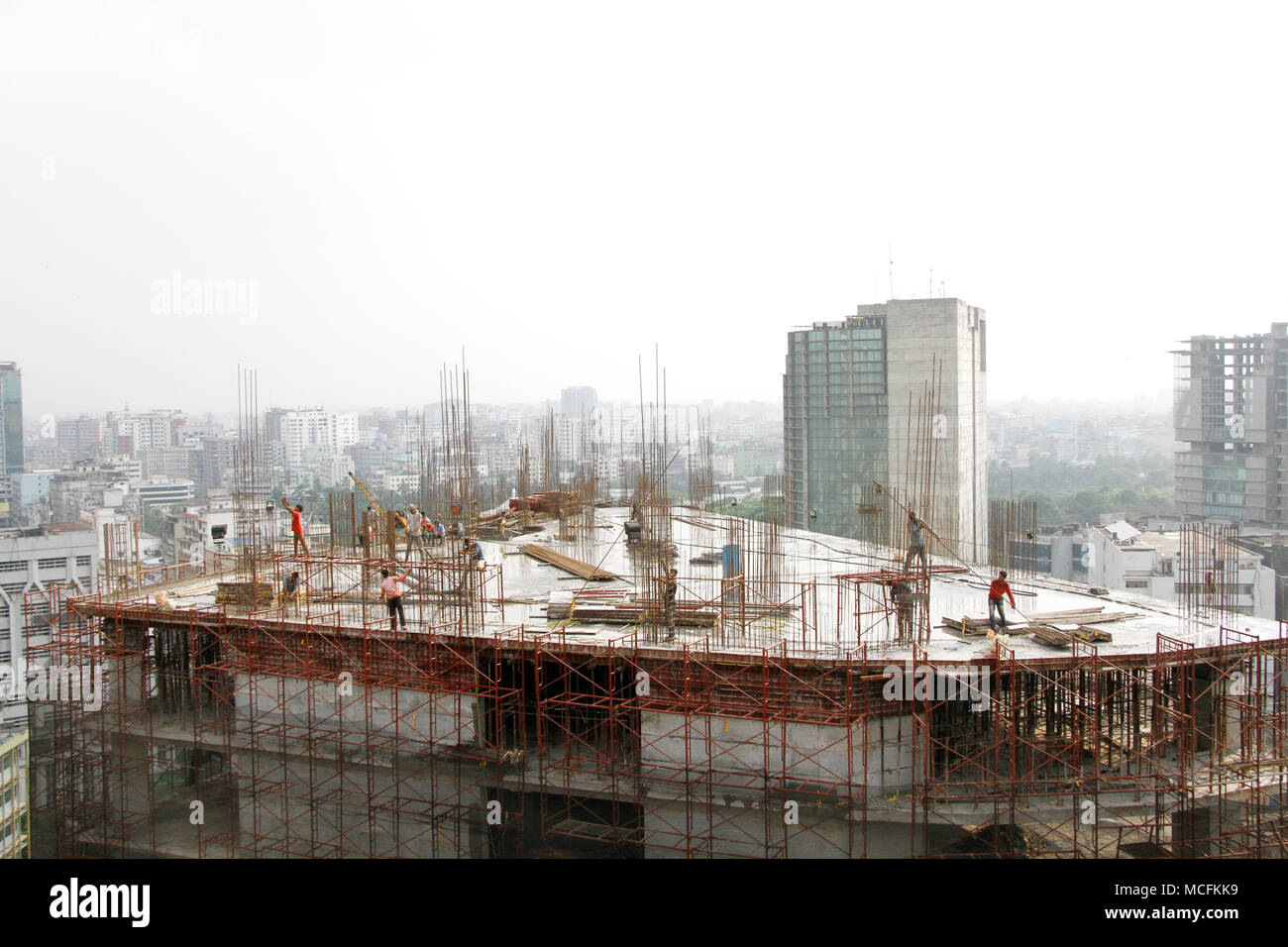 Dhaka, Bangladesh. Bangladeshi construction labors work on a new high ...