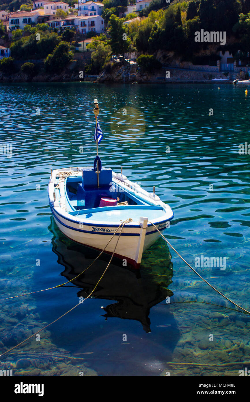 Small Boat floating in harbour Stock Photo - Alamy