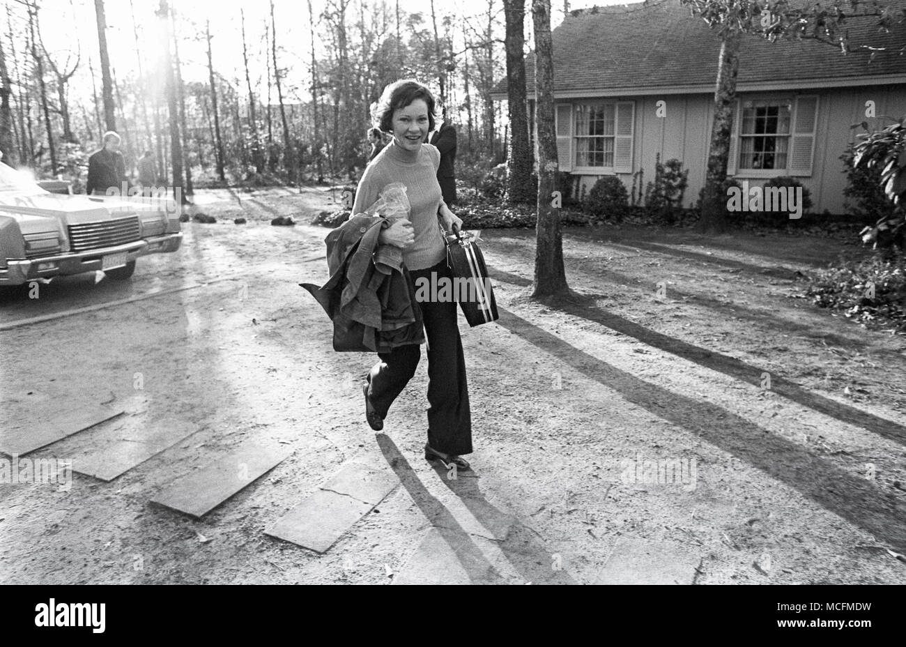 Rosalynn Carter carries her suitcase as she returns her home to Plains ...
