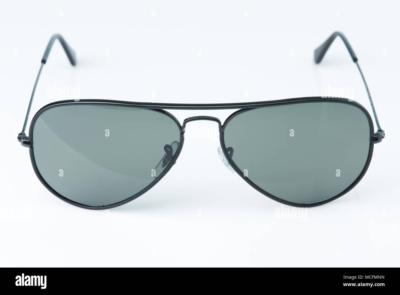 Front view of sunglasses with polarized lens isolated on white ...