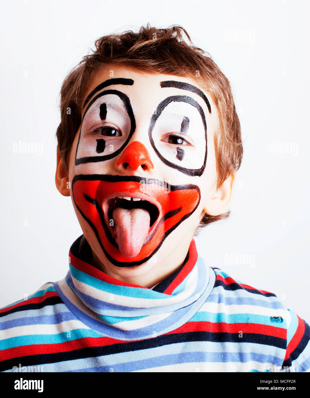 little cute real boy with facepaint like clown, pantomimic expressions ...