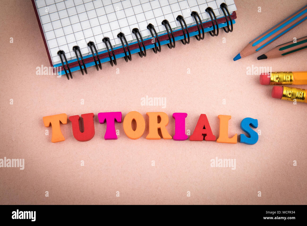 Tutorials. Wooden letters on the office desk Stock Photo - Alamy
