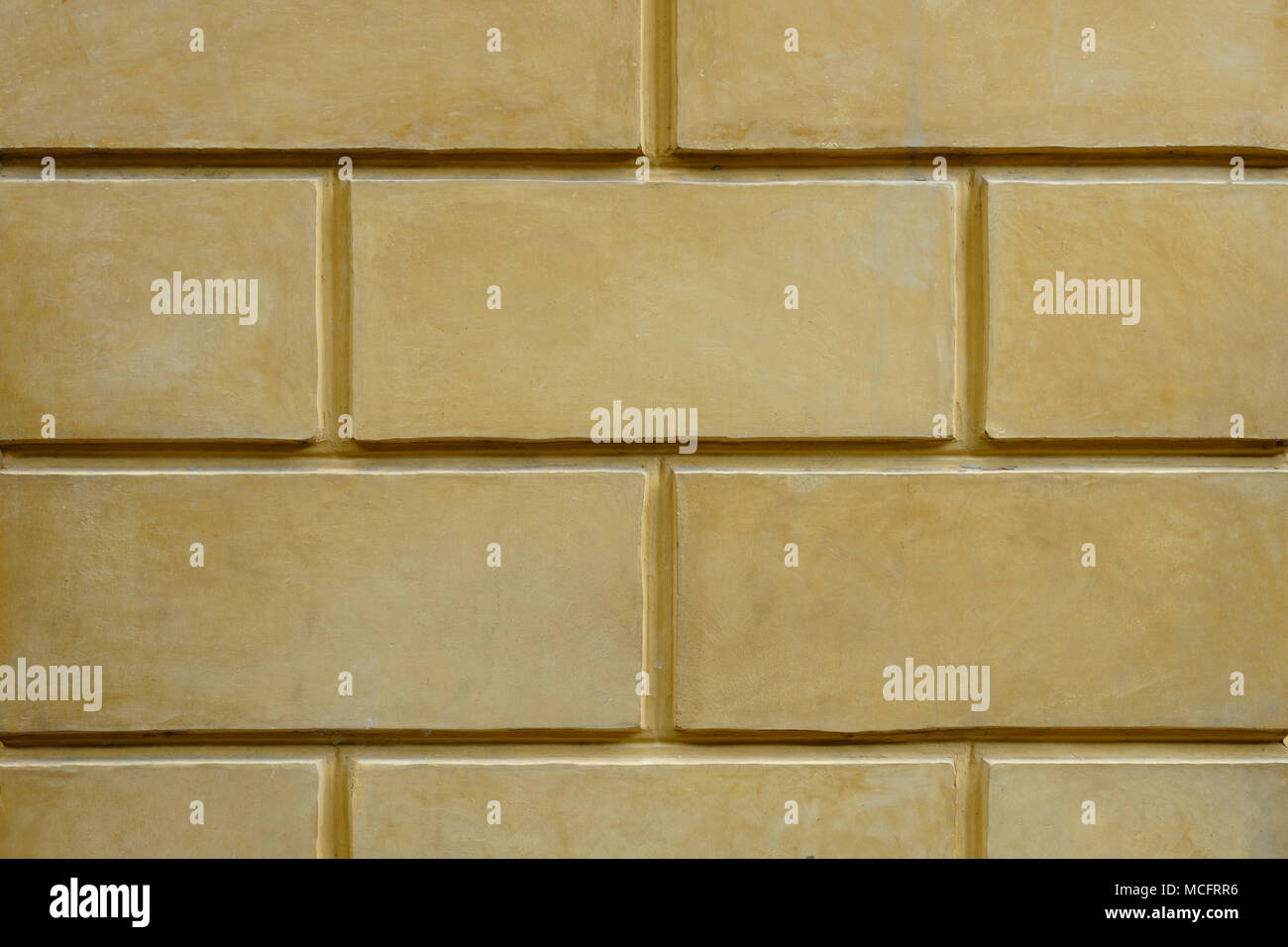 Yellow brick wall in the Roman era for background Stock Photo - Alamy