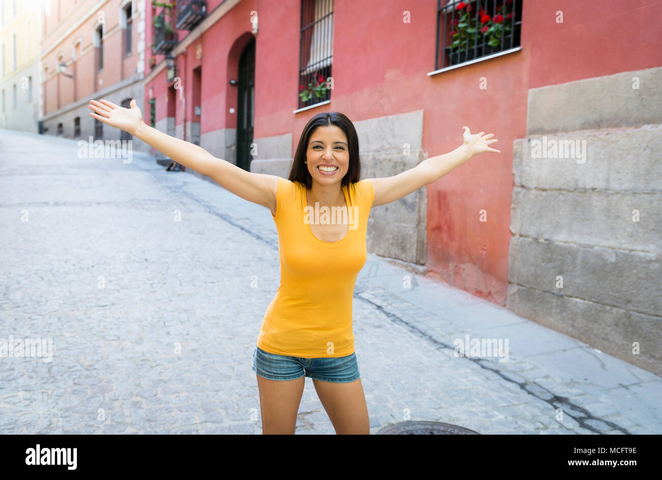 young attractive latin woman happy and excited posing on modern urban ...