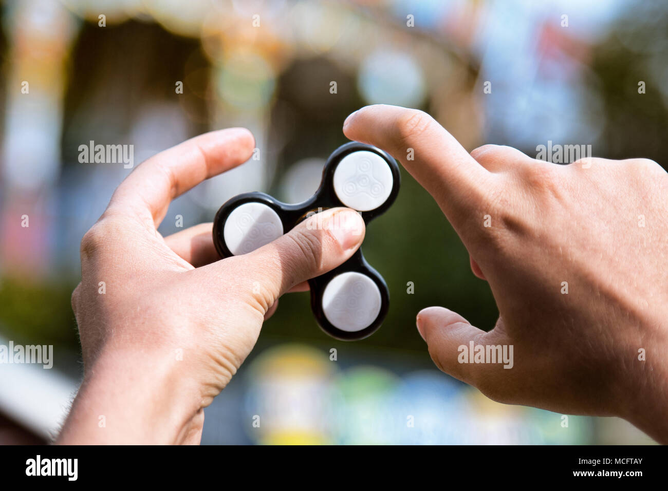 classic new trendy game for all. Hand spinner fidgeting hand toy Stock ...
