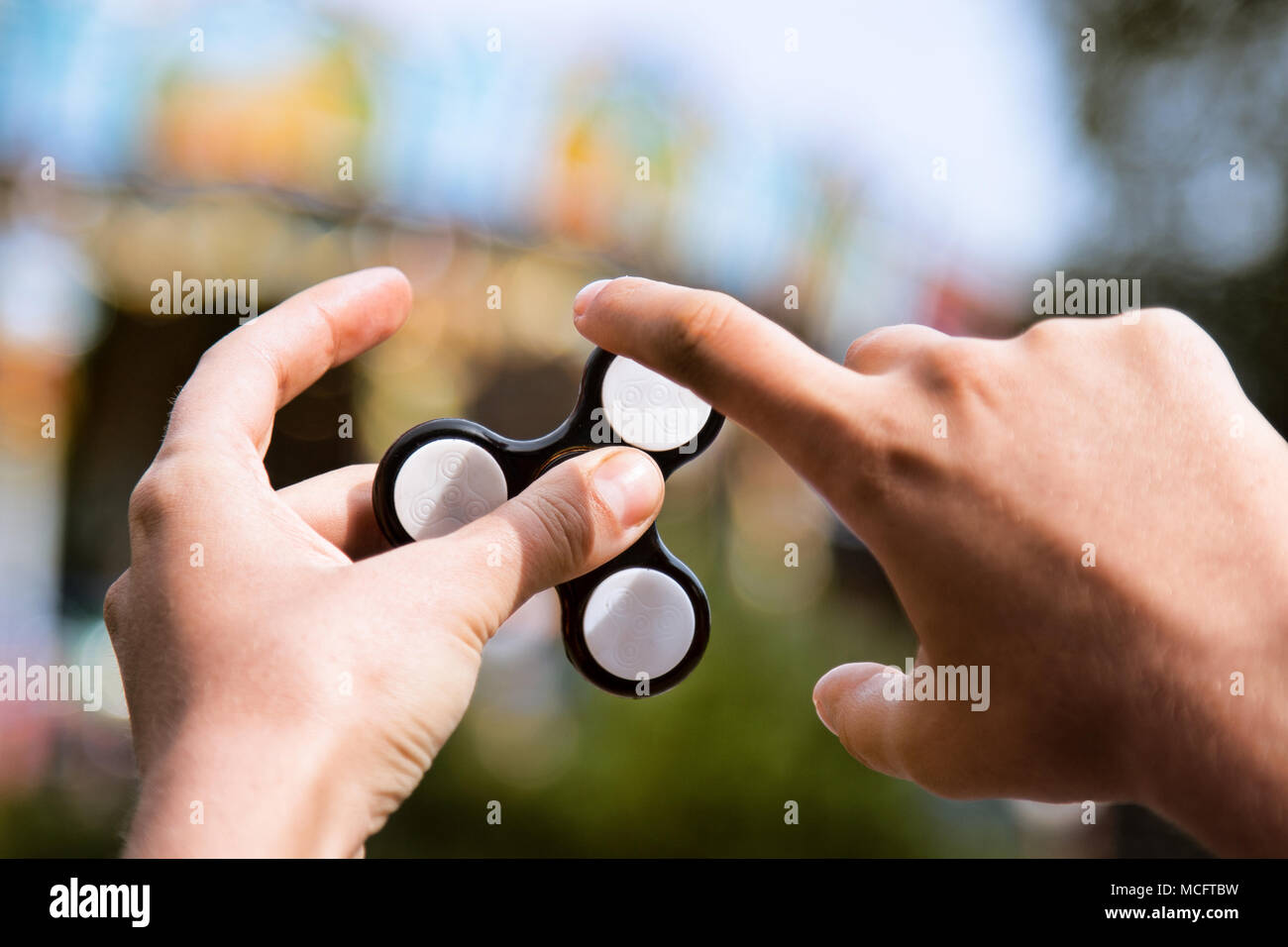 classic new trendy game for all. Hand spinner fidgeting hand toy Stock ...