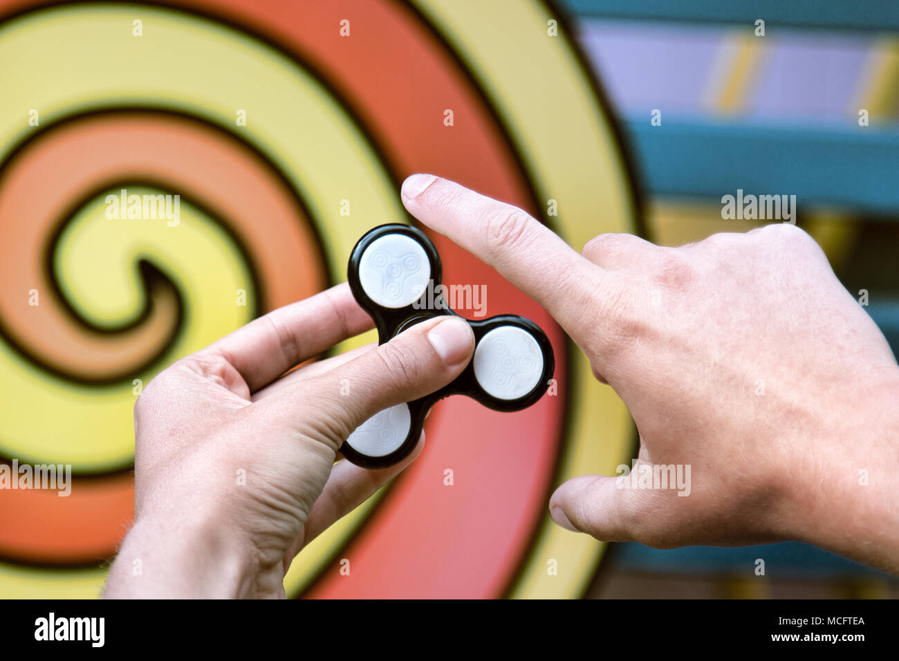 classic new trendy game for all. Hand spinner fidgeting hand toy Stock ...