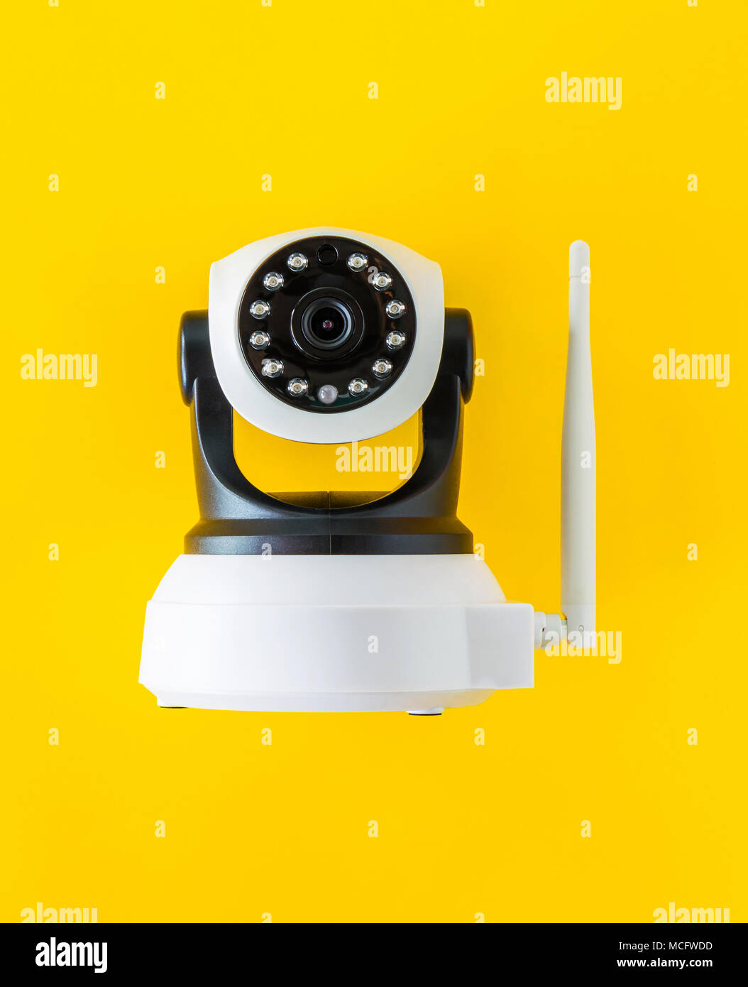 CCTV on yellow background Stock Photo - Alamy