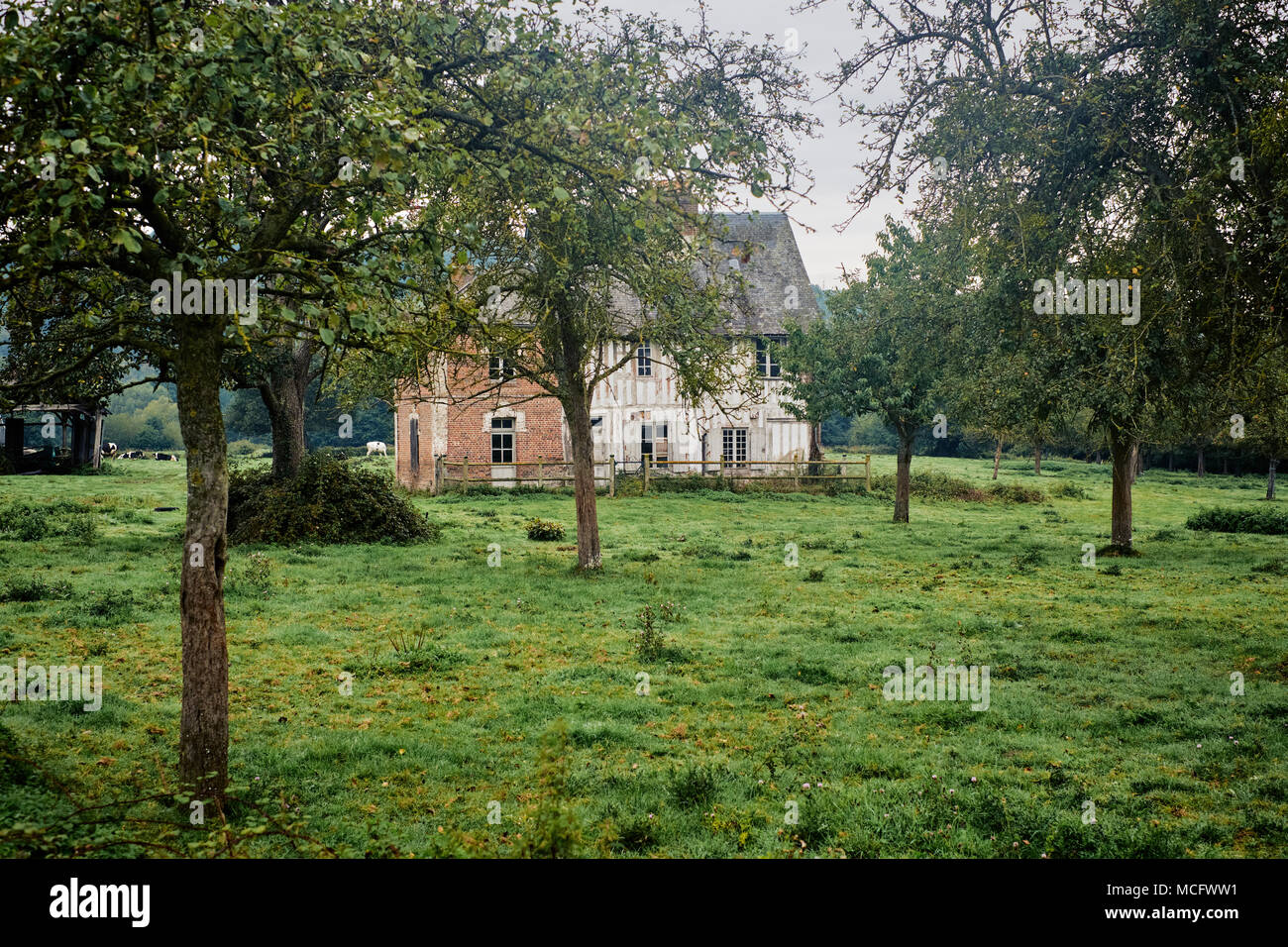 An old timbered cottage in the Normandy countryside of northern France ...