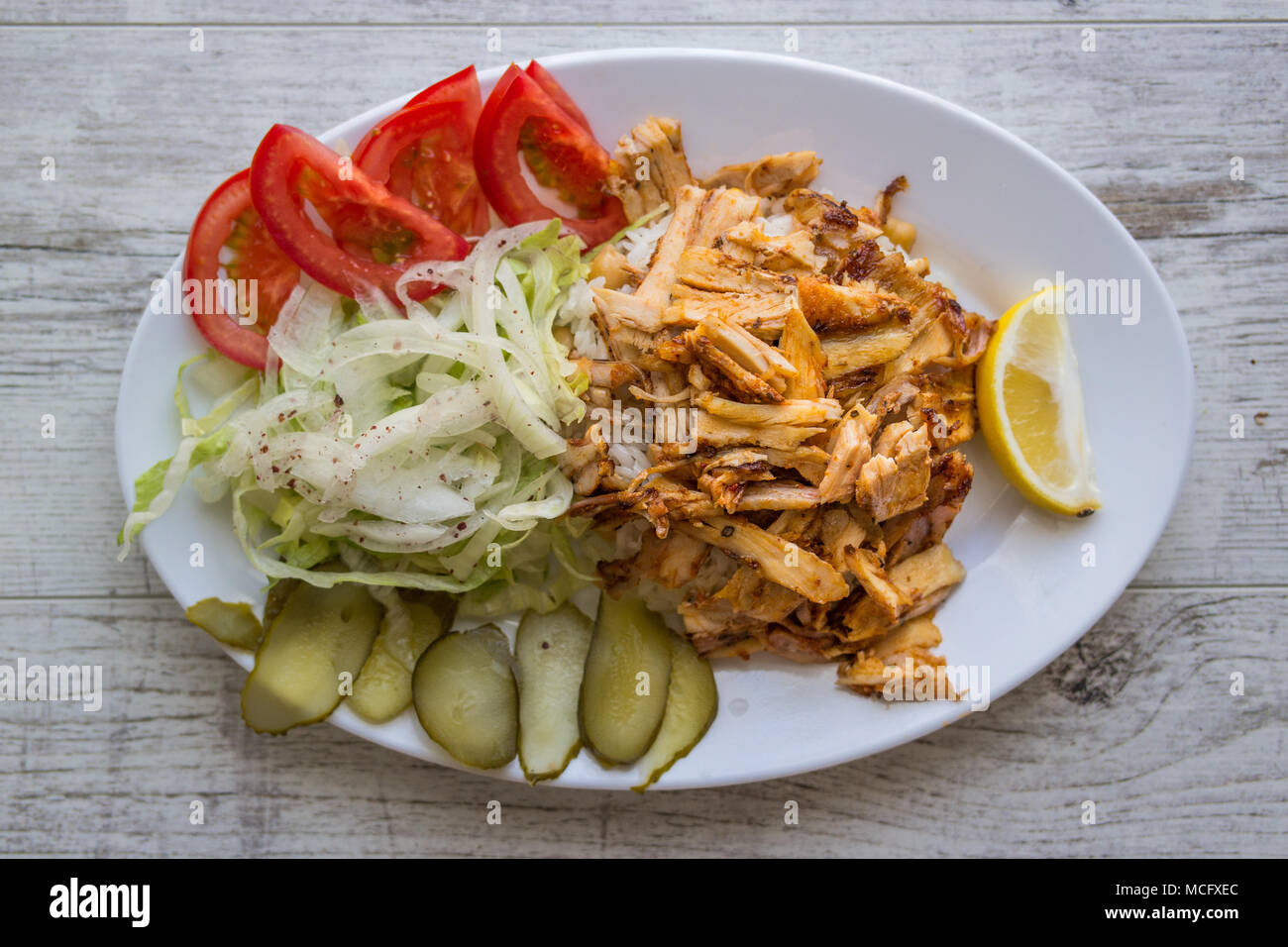 Turkish Chicken Doner Kebab with rice in a white plate Stock Photo - Alamy