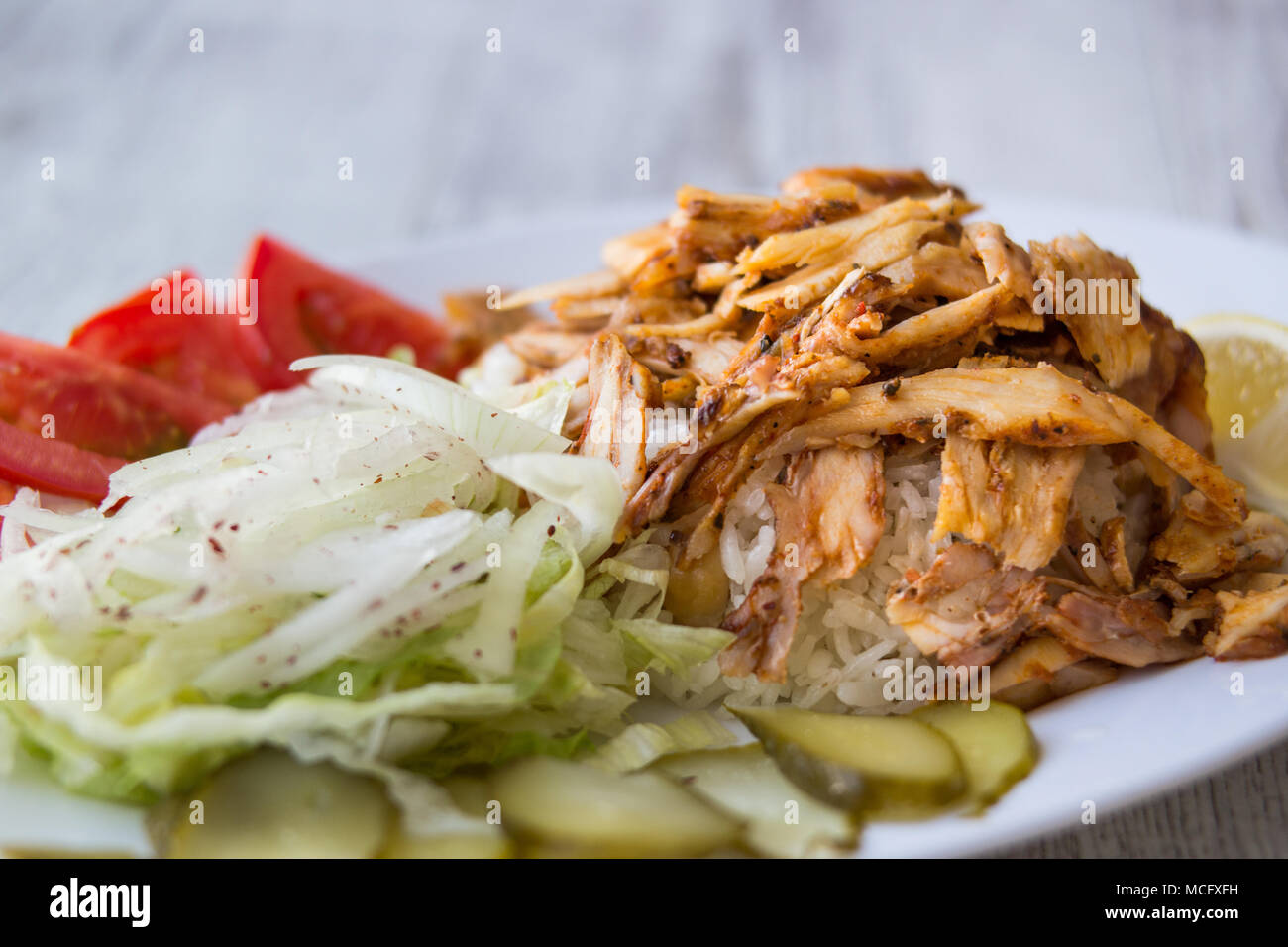 Turkish Chicken Doner Kebab with rice in a white plate Stock Photo - Alamy