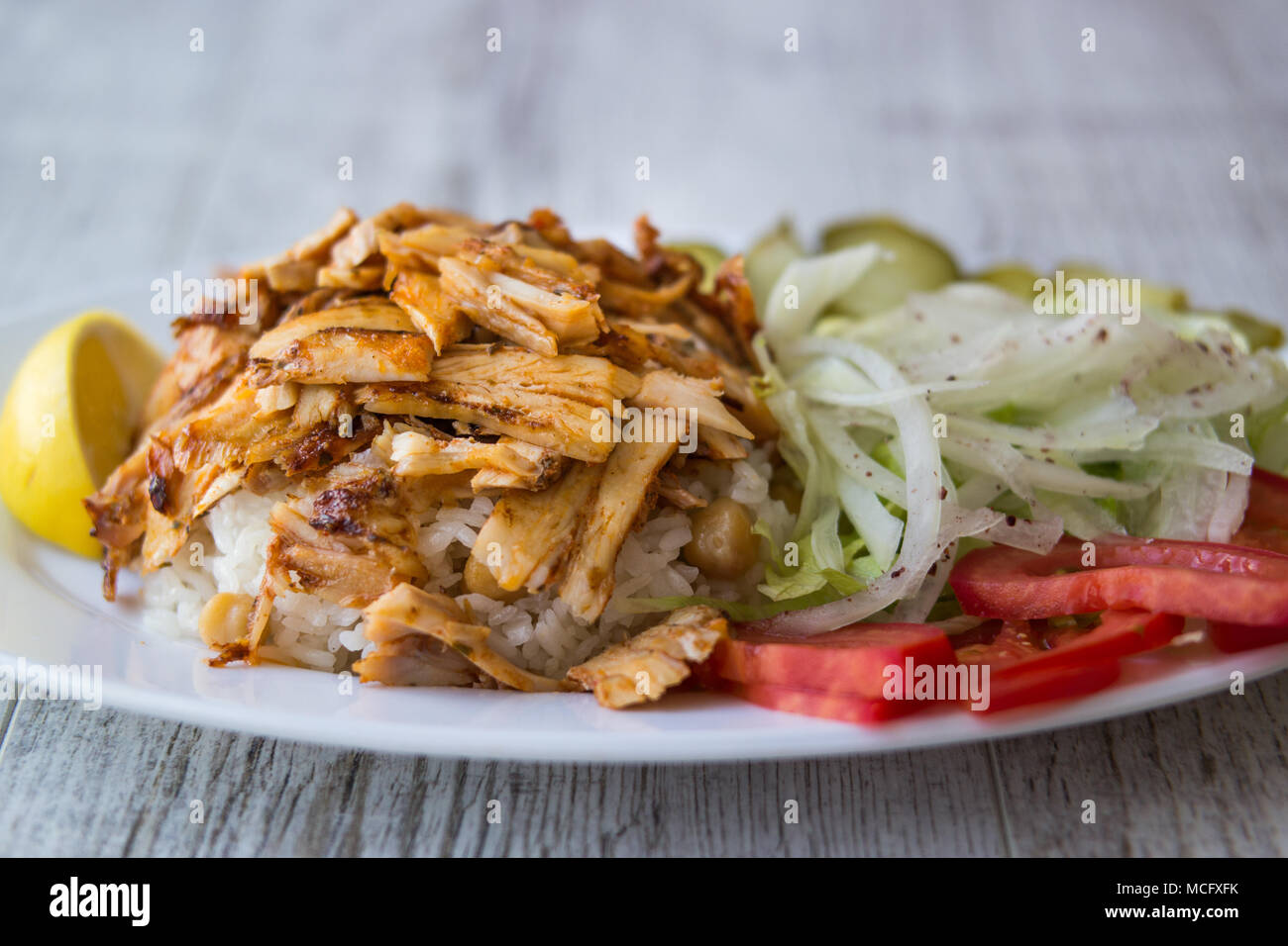 Turkish Chicken Doner Kebab with rice in a white plate Stock Photo - Alamy